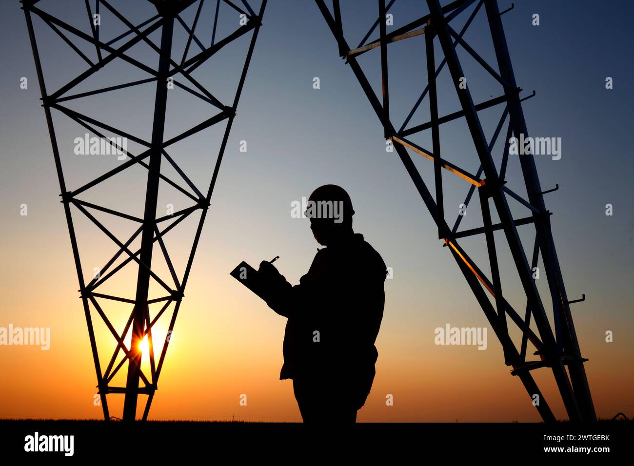 The workers of the pylon Stock Photo - Alamy