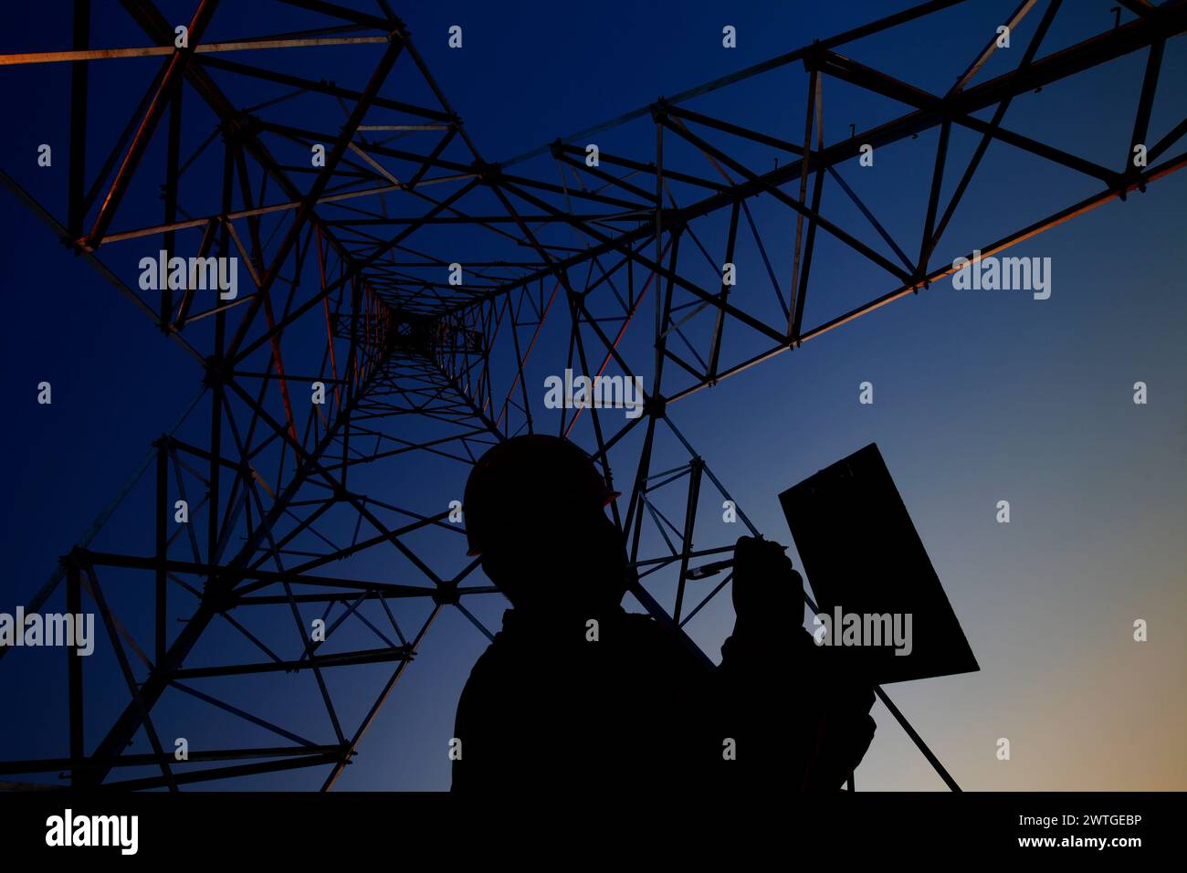 The workers of the pylon Stock Photo - Alamy