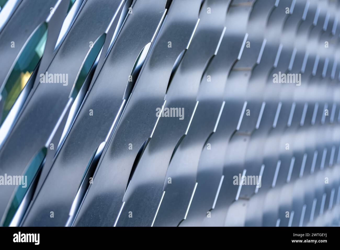 Close-up photo of silver gray angled exterior aluminum louvers over a ...