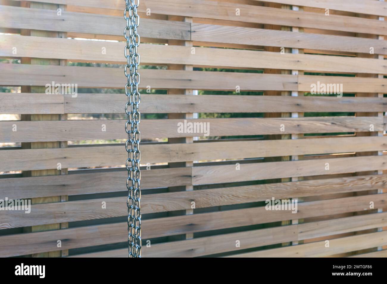 Steel linked chain used as a down spout for rain gutters Stock Photo ...