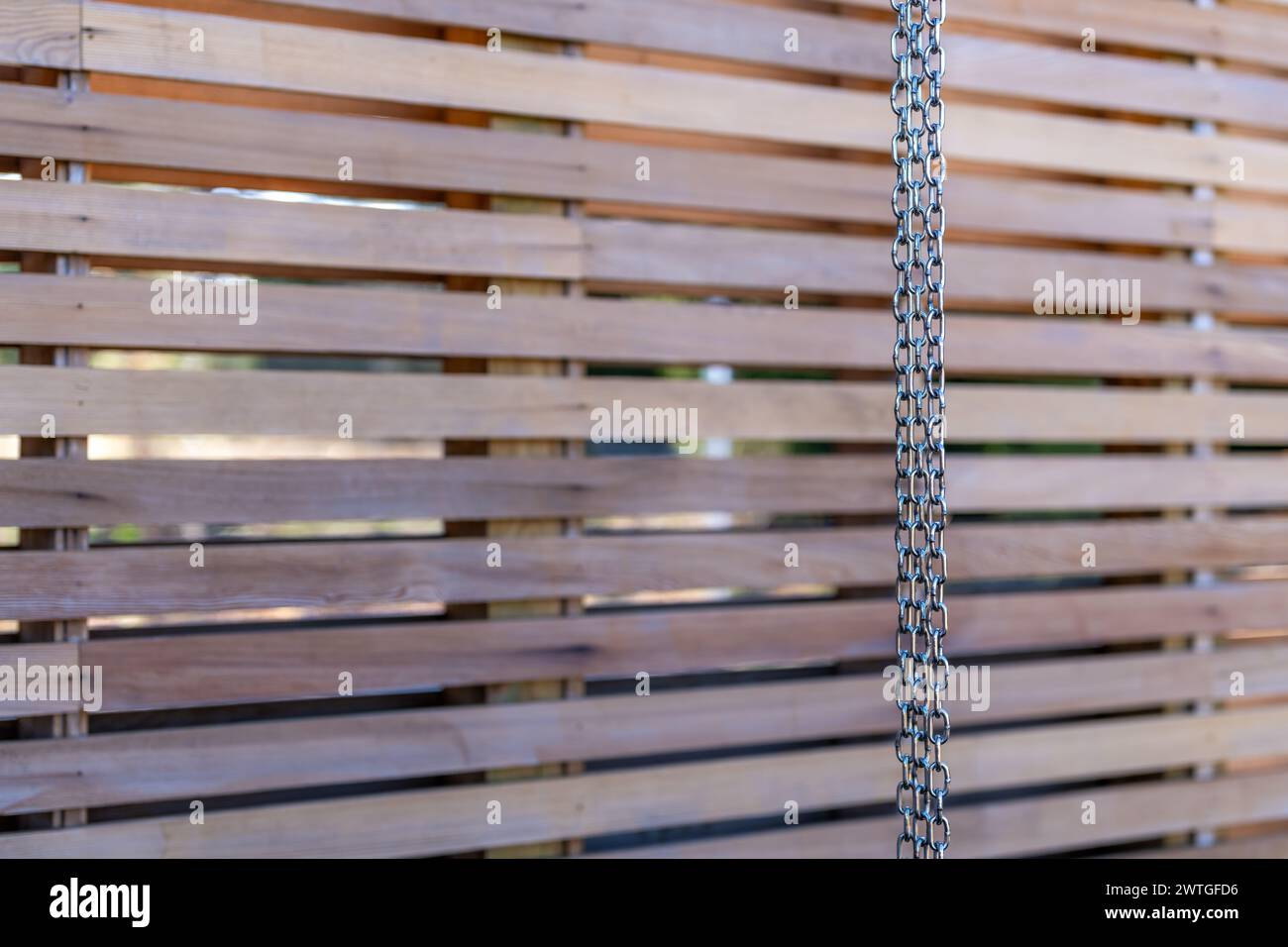 Steel linked chain used as a down spout for rain gutters Stock Photo ...