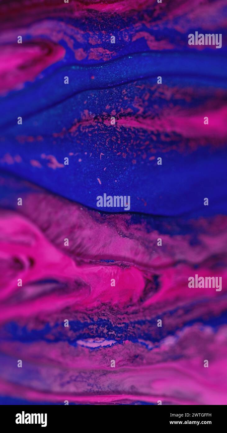 Glitter fluid drip paint spill pink blue ink blend Stock Photo - Alamy