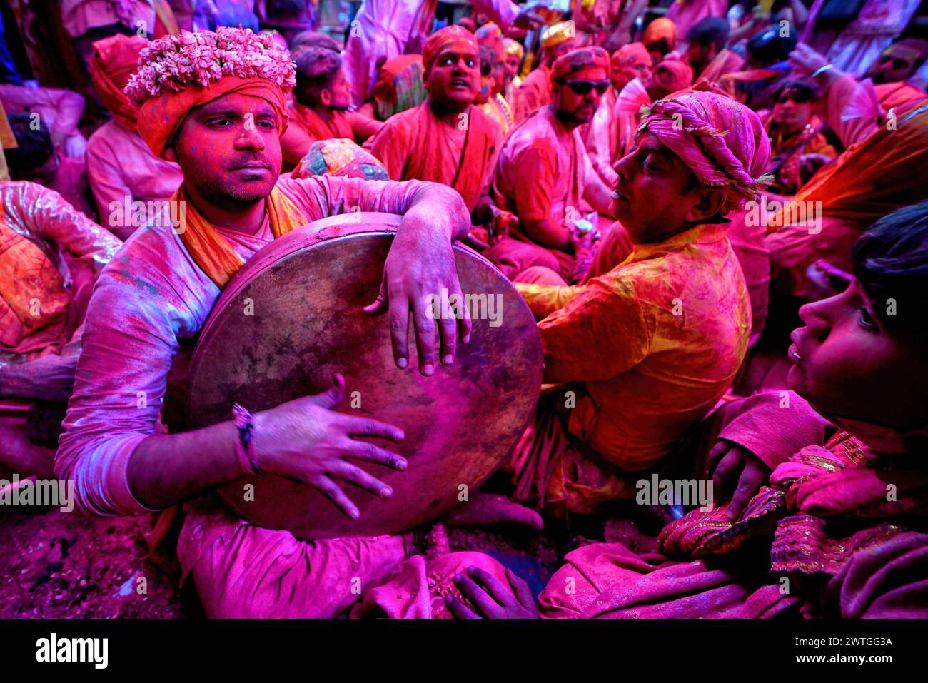 Mathura, India. 17th Mar, 2024. Hindu devotees smeared in colours ...