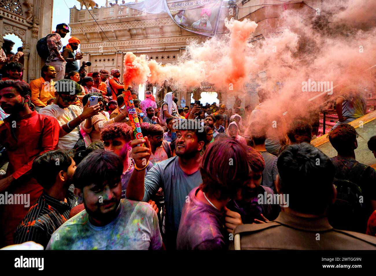 Mathura, India. 17th Mar, 2024. A Hindu devotee playing with a colorful ...