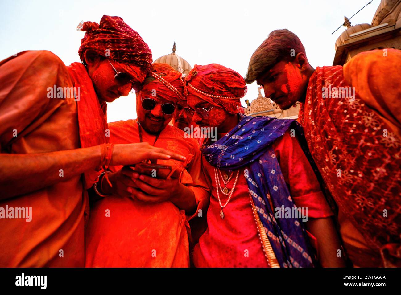 Mathura, India. 17th Mar, 2024. Hindu devotees smeared in colours ...