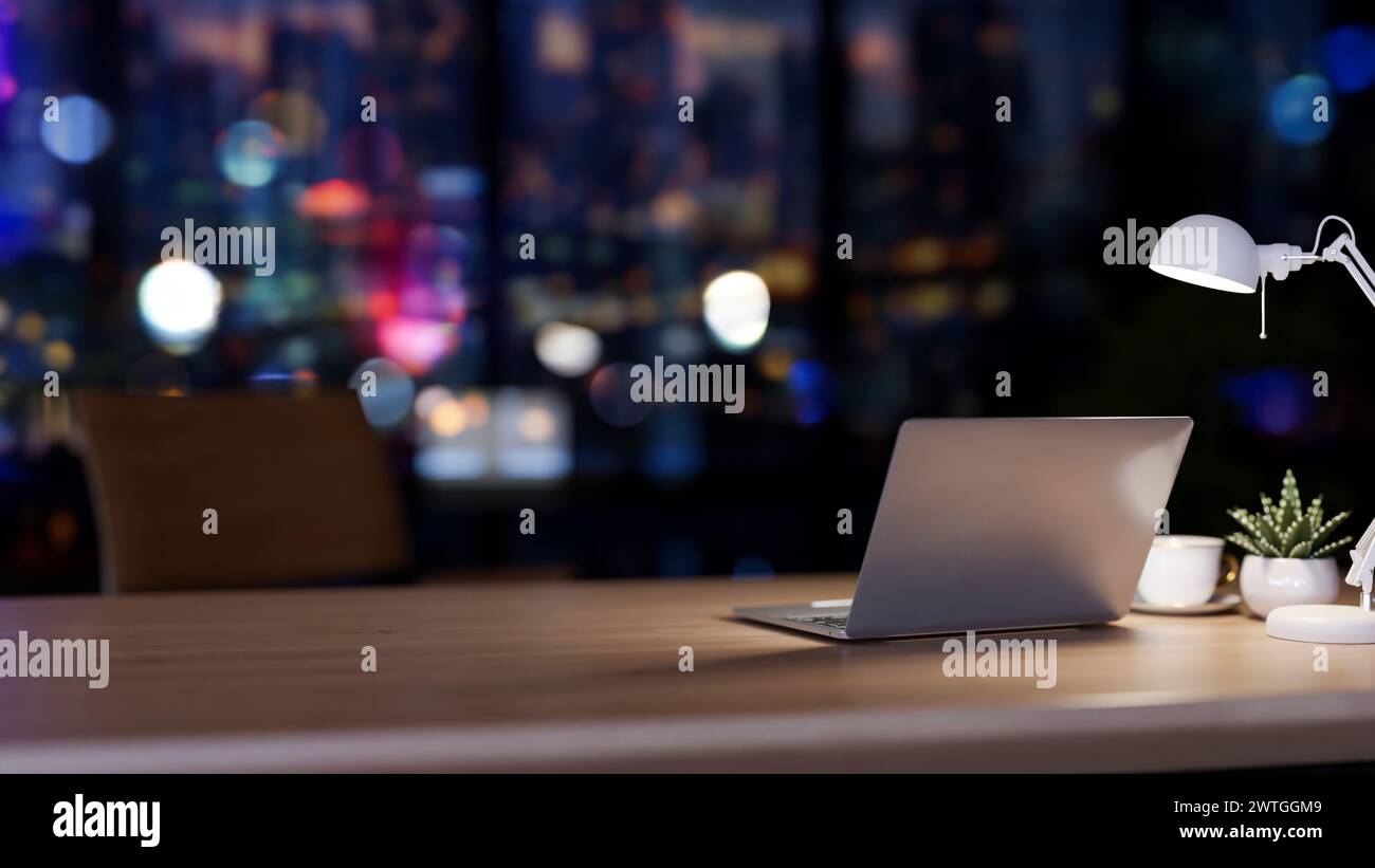 A back view image of a modern office desk in a modern skyscraper office ...
