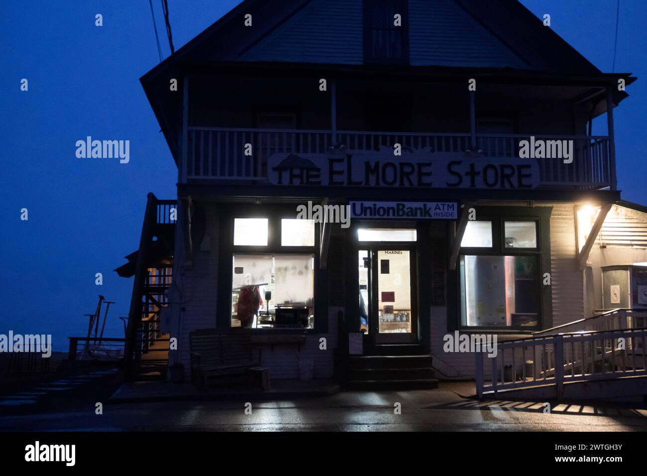 Robin Pough raises a window blind as she arrives to open the Elmore ...
