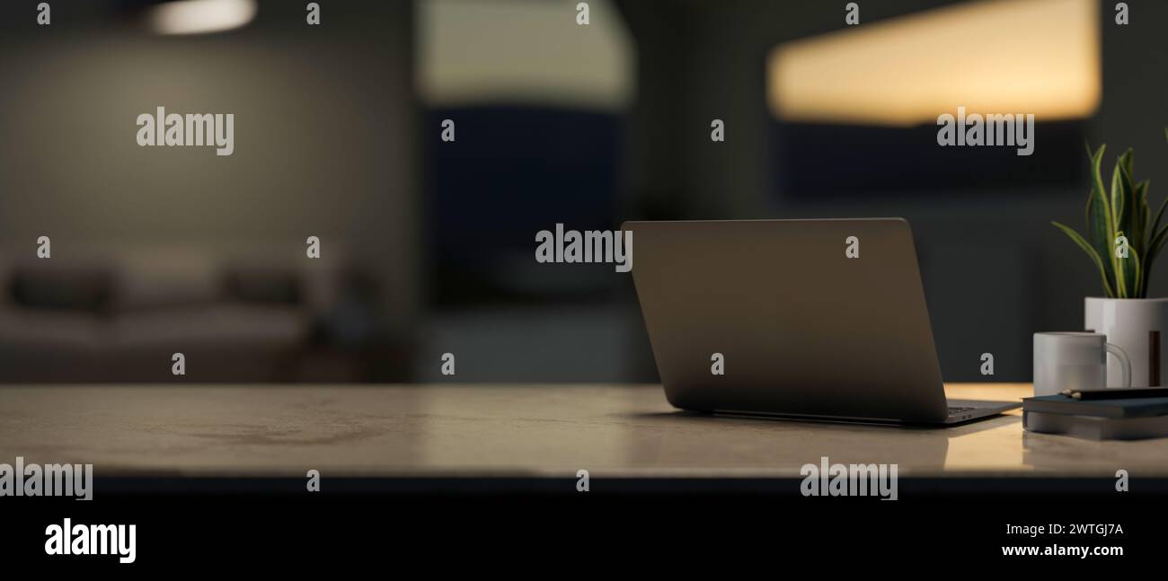 A back view image of a laptop computer and decor on a table in a ...
