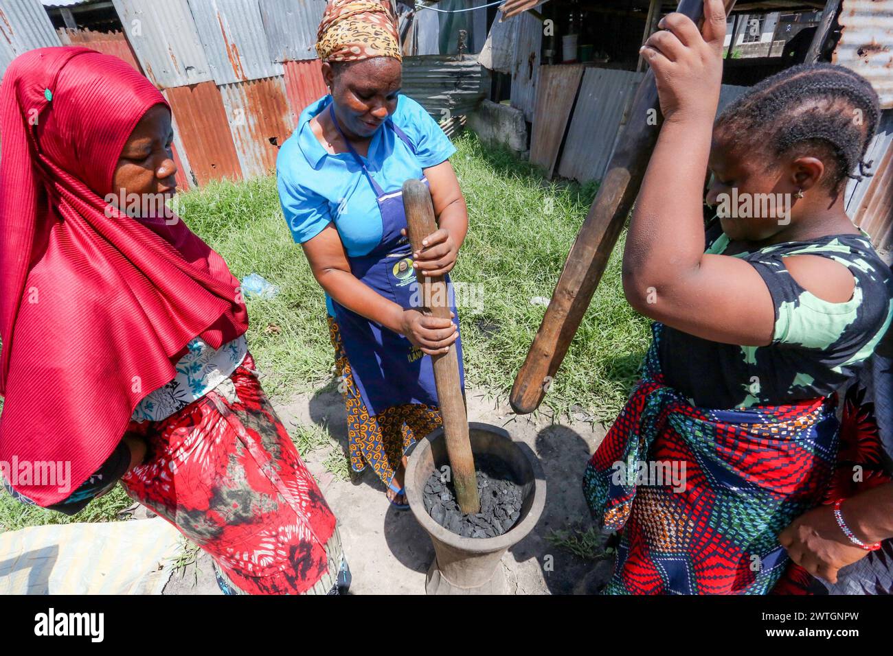 Dar Es Salaam, Tanzania. 16th Mar, 2024. Members of a women's group use ...