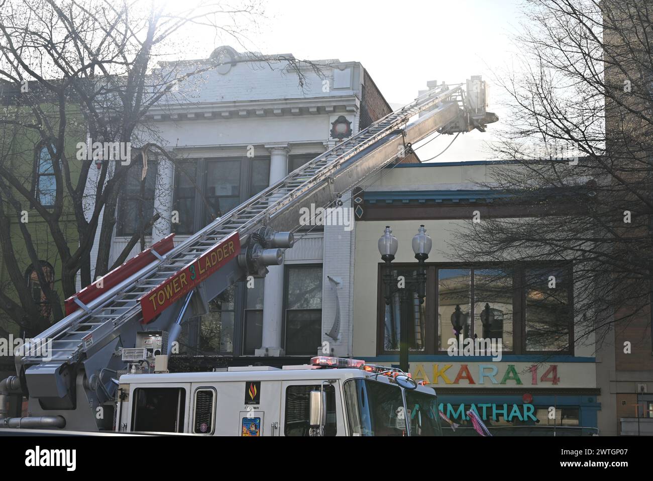 Ladder truck extends the ladder at a working structure fire in ...