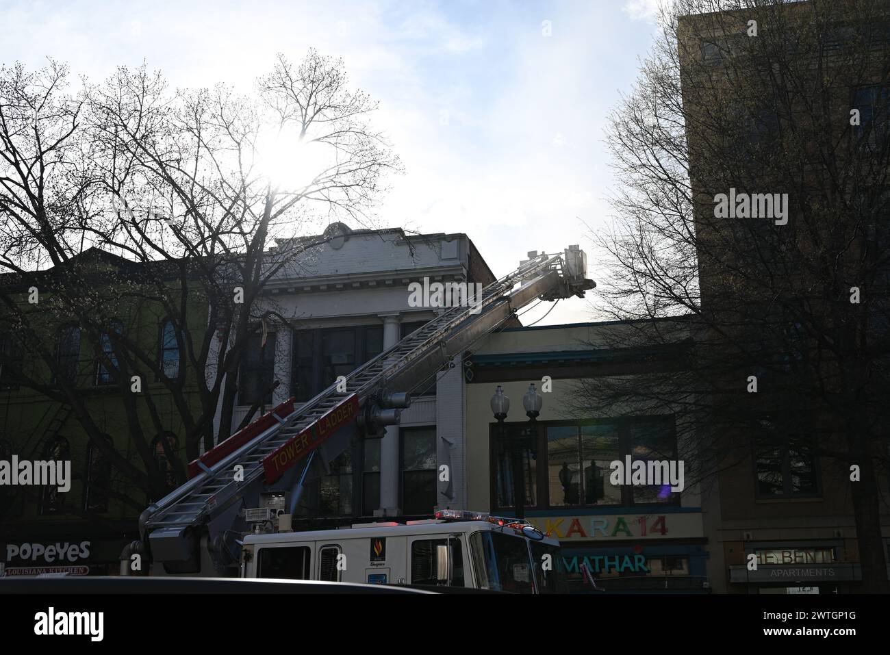 Ladder truck extends the ladder at a working structure fire in ...