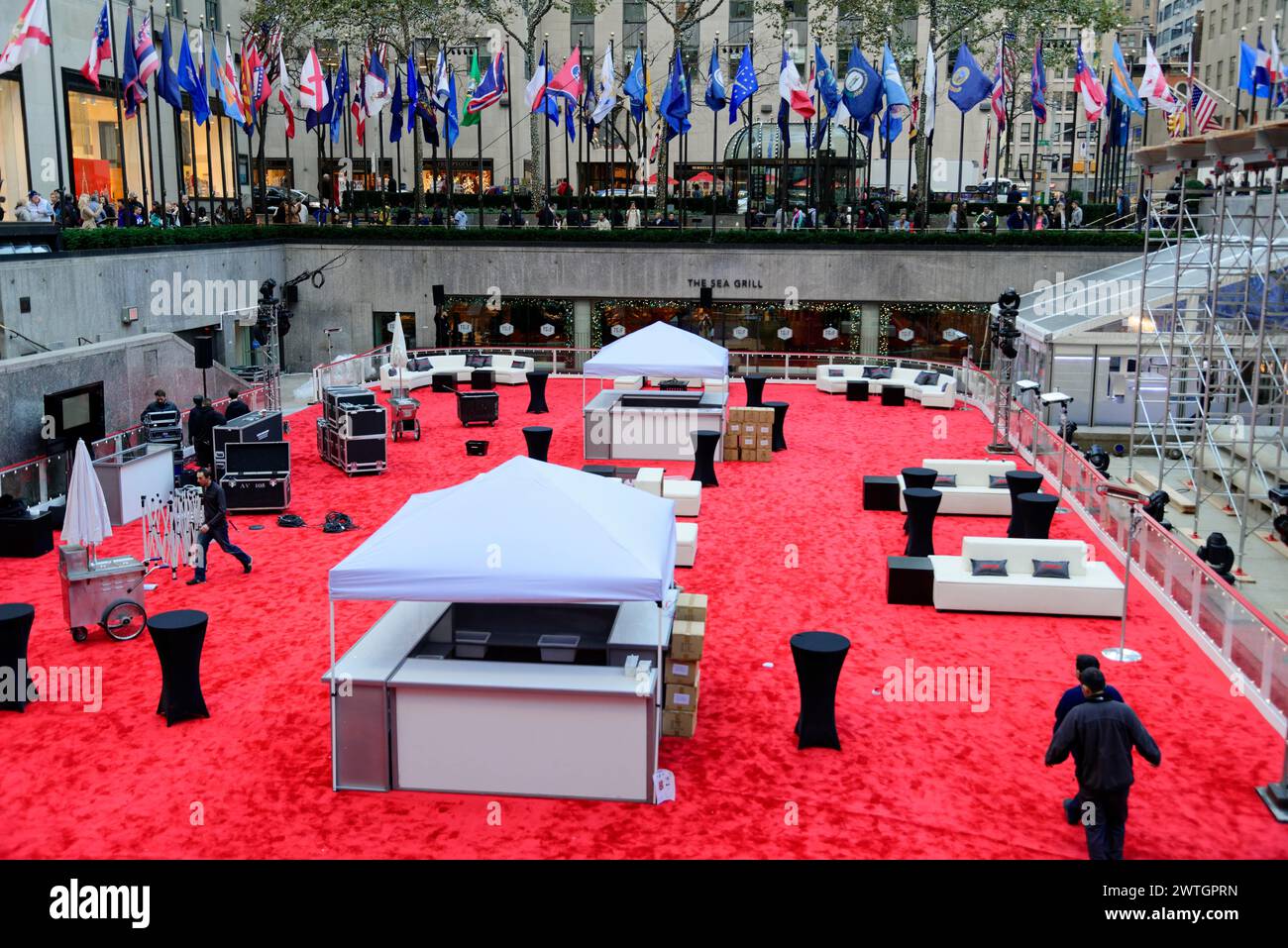 Rockefeller Center, open-air event with red carpet and tables ...