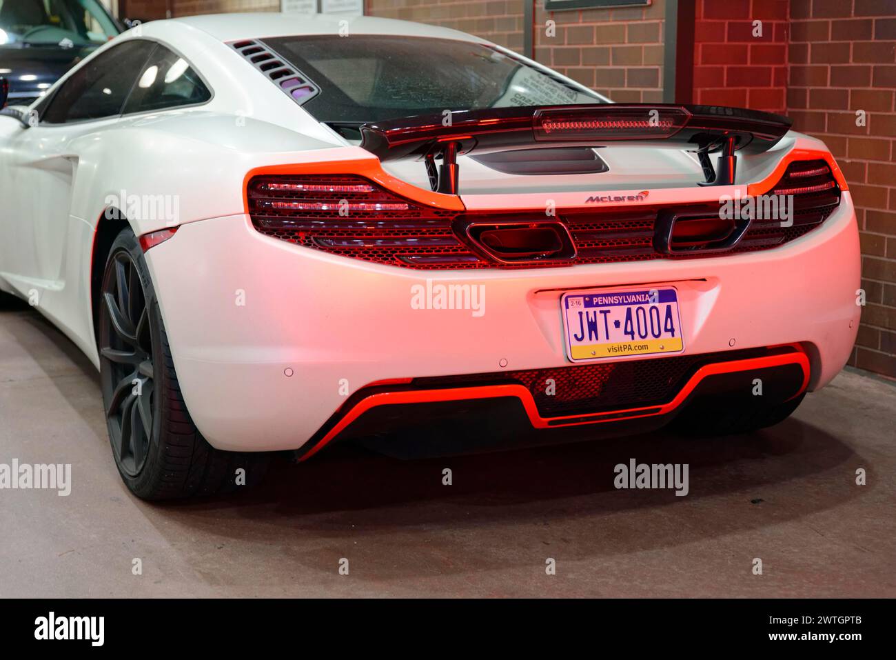 Rear view of a white McLaren sports car with red accents, Manhattan ...