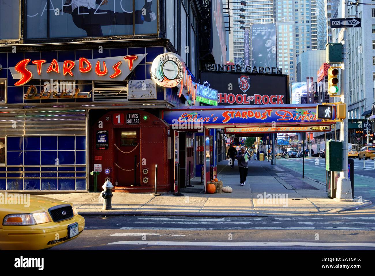 View of the famous Ellen's Stardust Diner with neon-lit facade ...