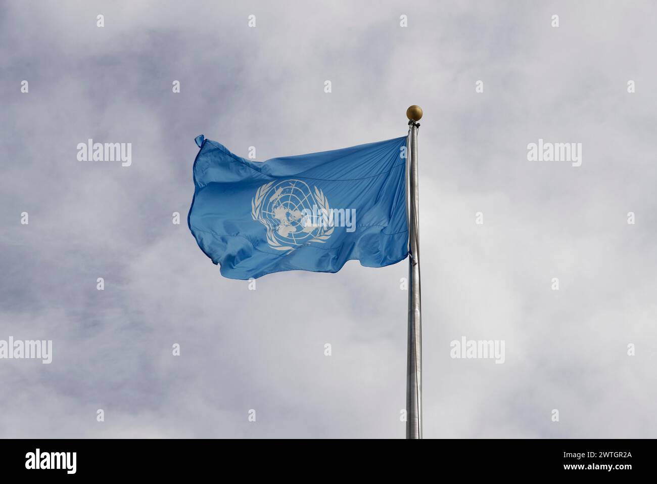 UN Headquarters, East River, The light blue flag of the United Nations ...