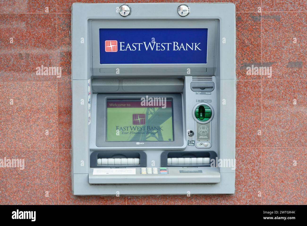 ATM of the EastWest Bank, mounted on an outside wall, Manhattan, New ...