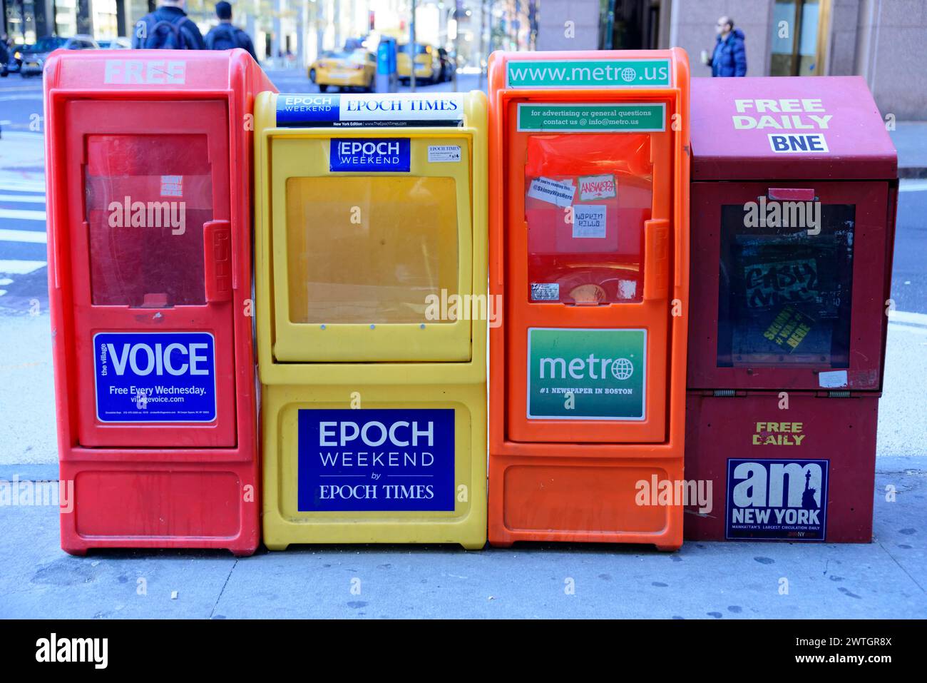 Row of colourful newspaper boxes on a pavement in New York, Manhattan ...