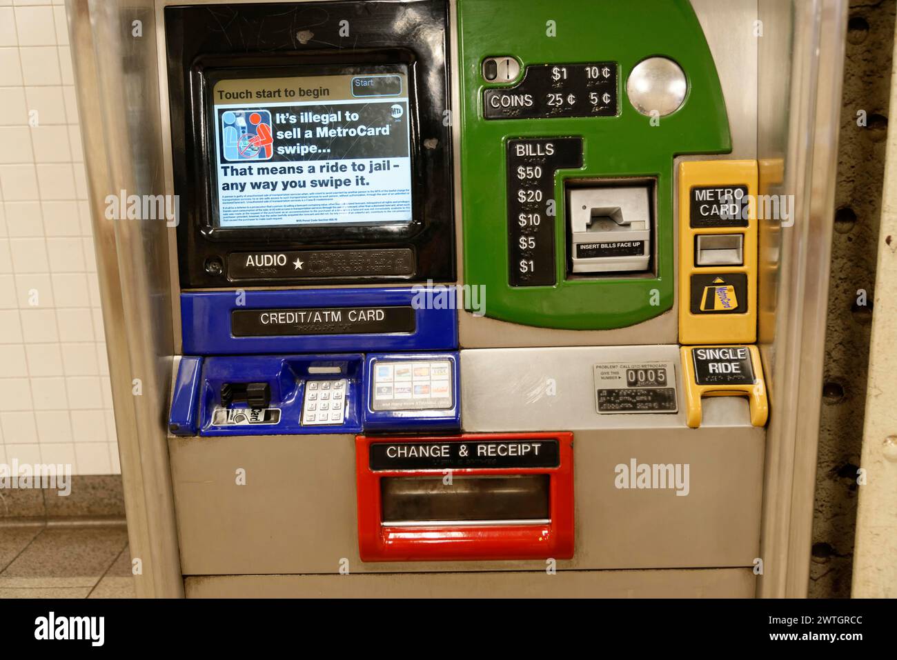 Illuminated ticket machine displays ticket purchase options and prices ...