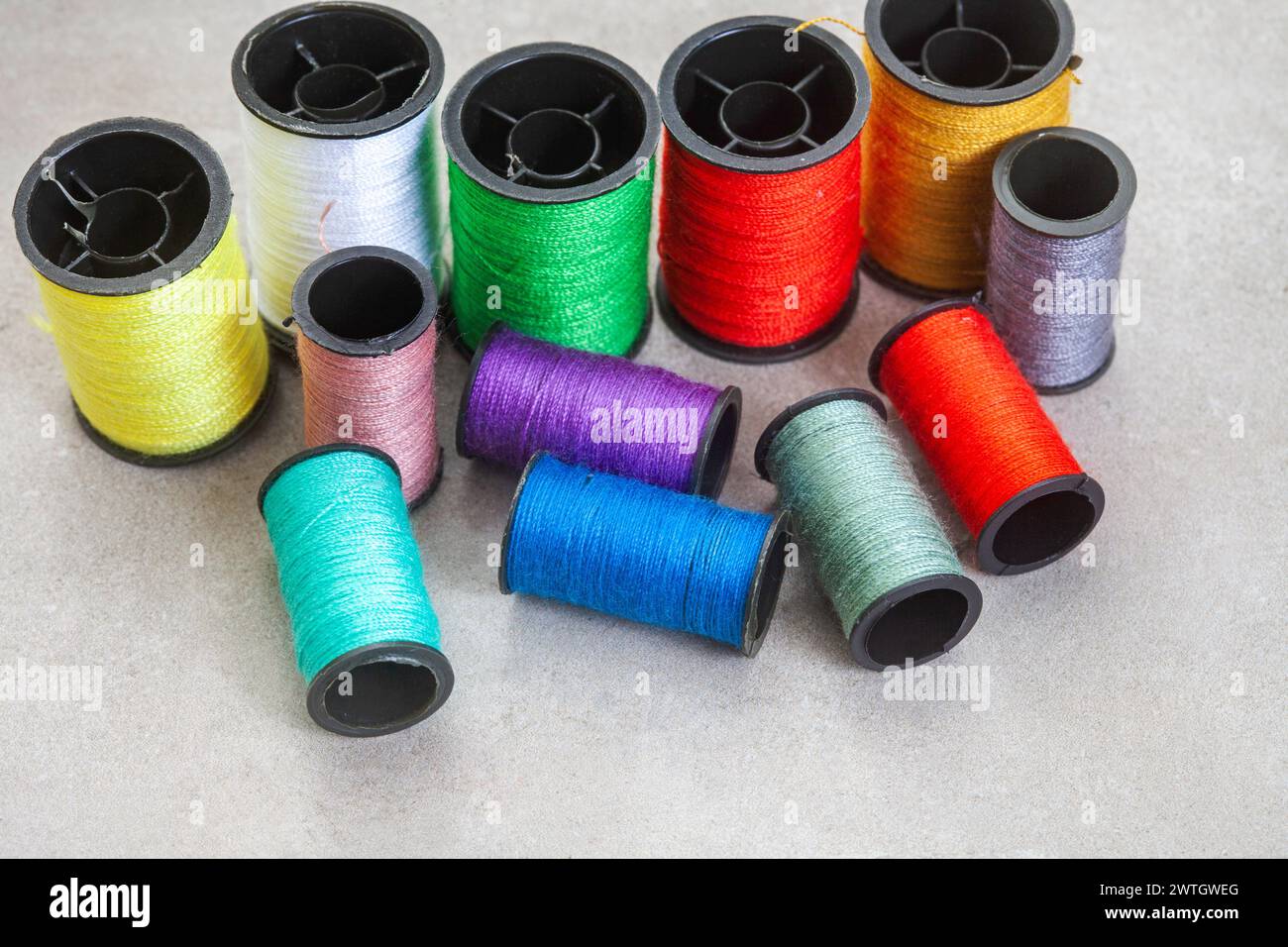 collection of colorful sewing thread on grey, with copy space Stock ...