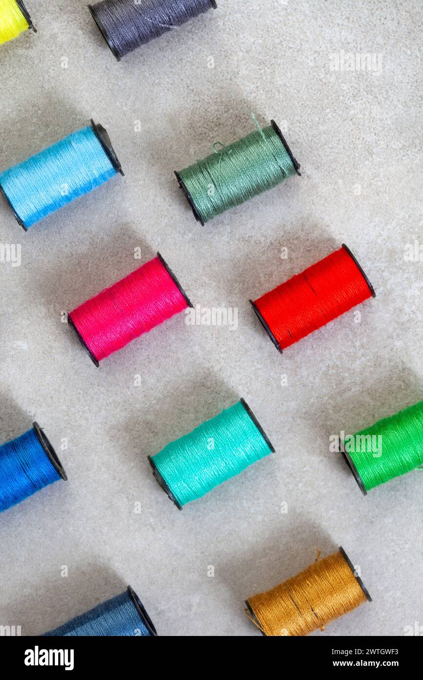 collection of colorful sewing thread on grey, with copy space Stock ...