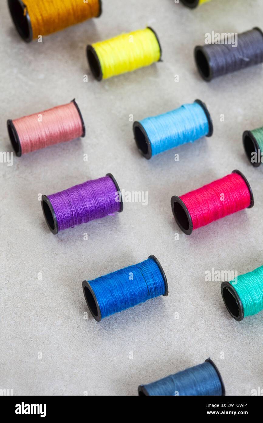 collection of colorful sewing thread on grey, with copy space Stock ...