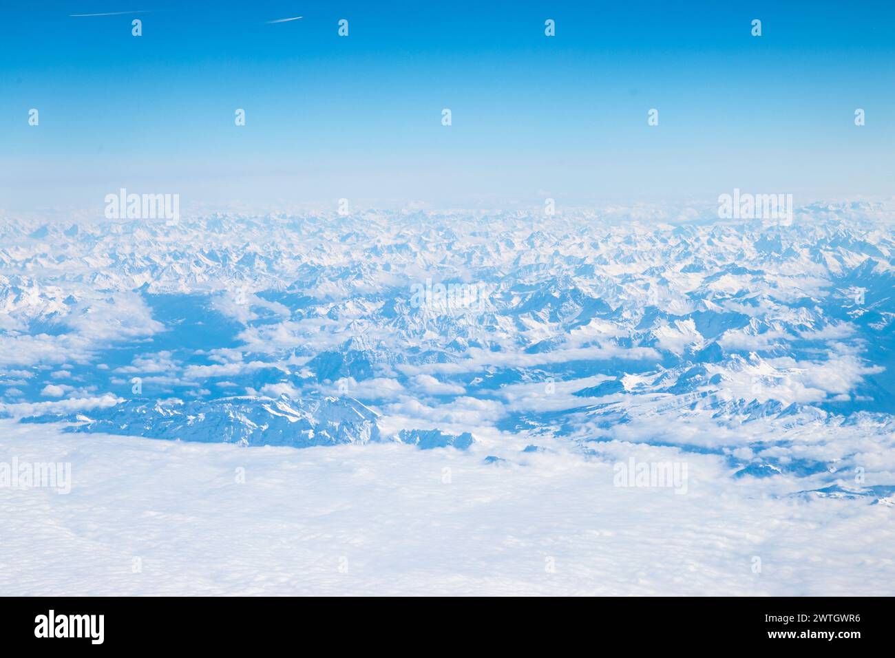 An aerial view of the Alps, a European mountain range and also the ...