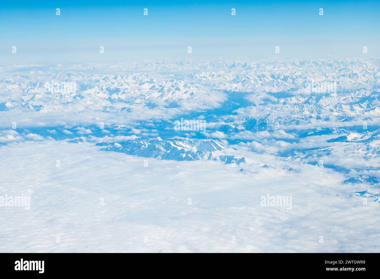 An aerial view of the Alps, a European mountain range and also the ...