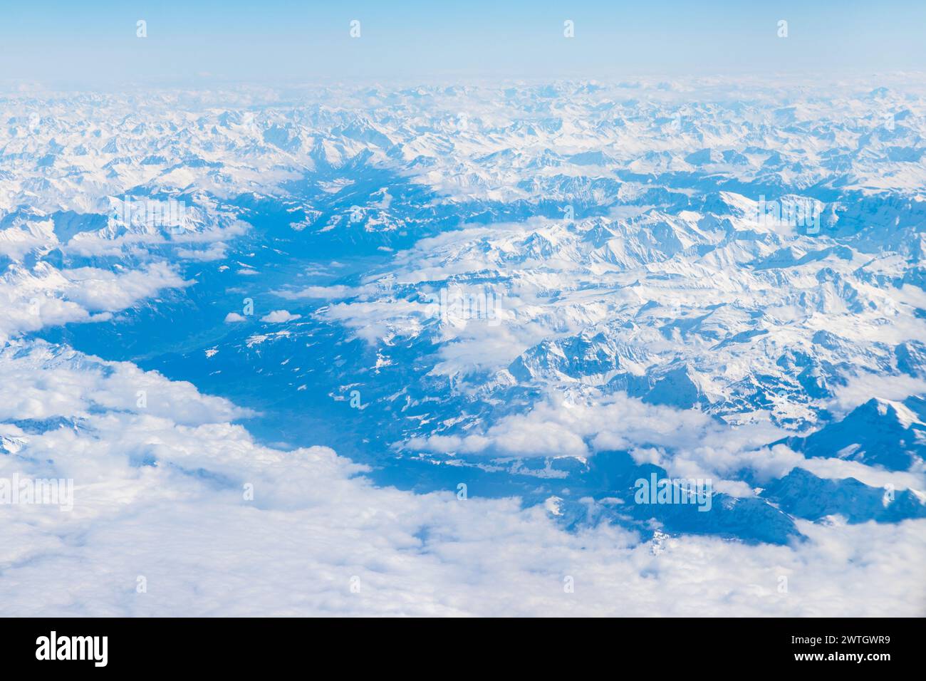 An aerial view of the Alps, a European mountain range and also the ...