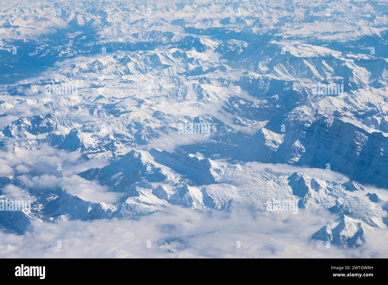 An aerial view of the Alps, a European mountain range and also the ...