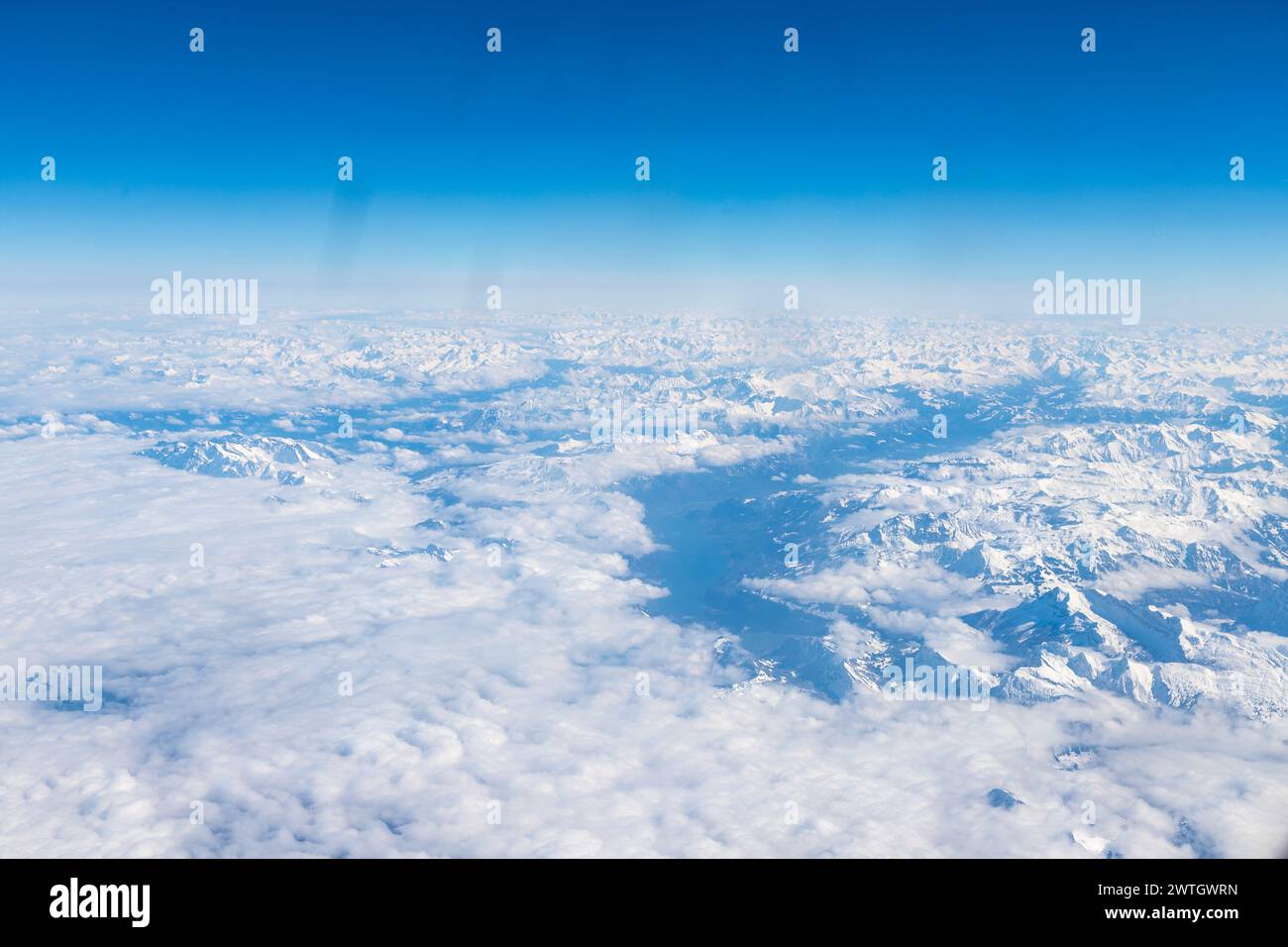 An aerial view of the Alps, a European mountain range and also the ...