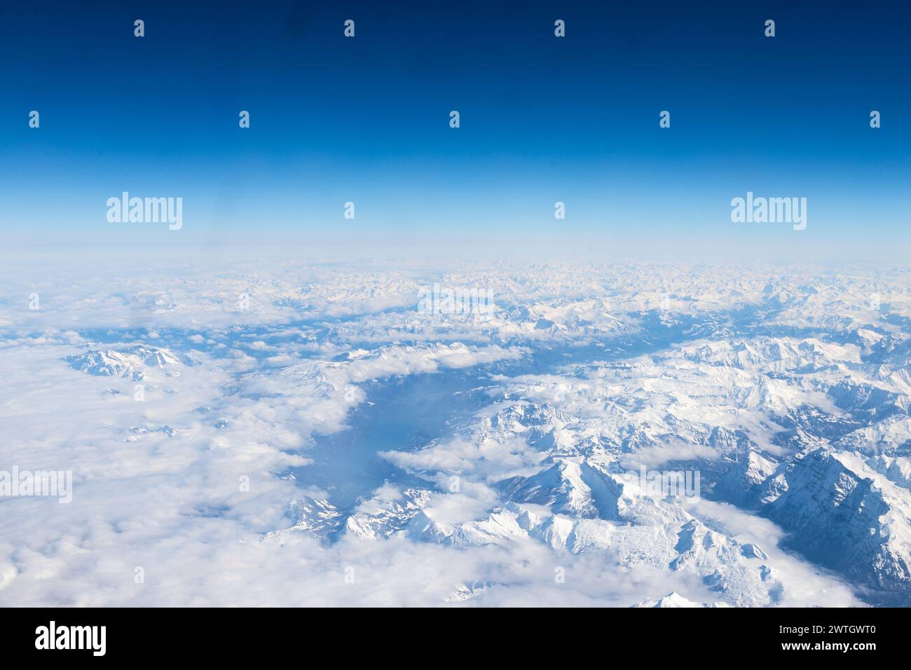 An aerial view of the Alps, a European mountain range and also the ...
