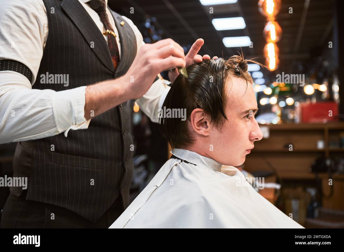 Barbershop salon barber working giving haircut hi-res stock photography ...