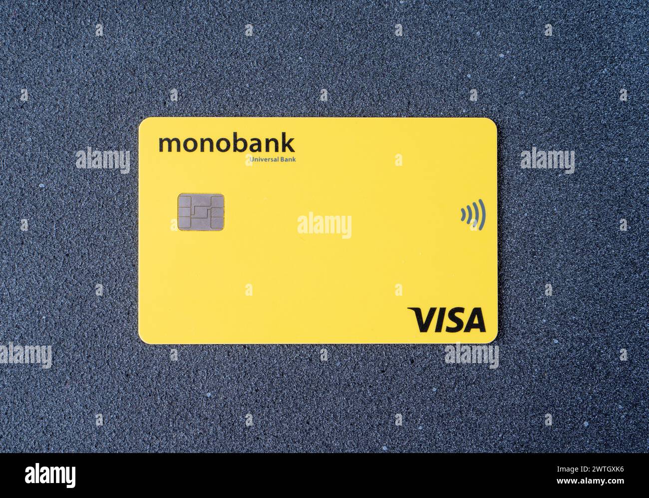 Credit card of the Ukrainian bank Monobank from Universal Bank. Yellow Visa card with chip ...