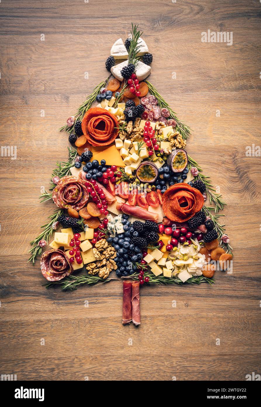 Meat selection, Cutting sausage and cured meat with cheese and fruits ...