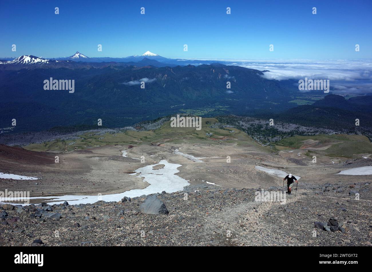 Hiking in Patagonia, Tourist walking up steep slope of volcano Puyehue ...