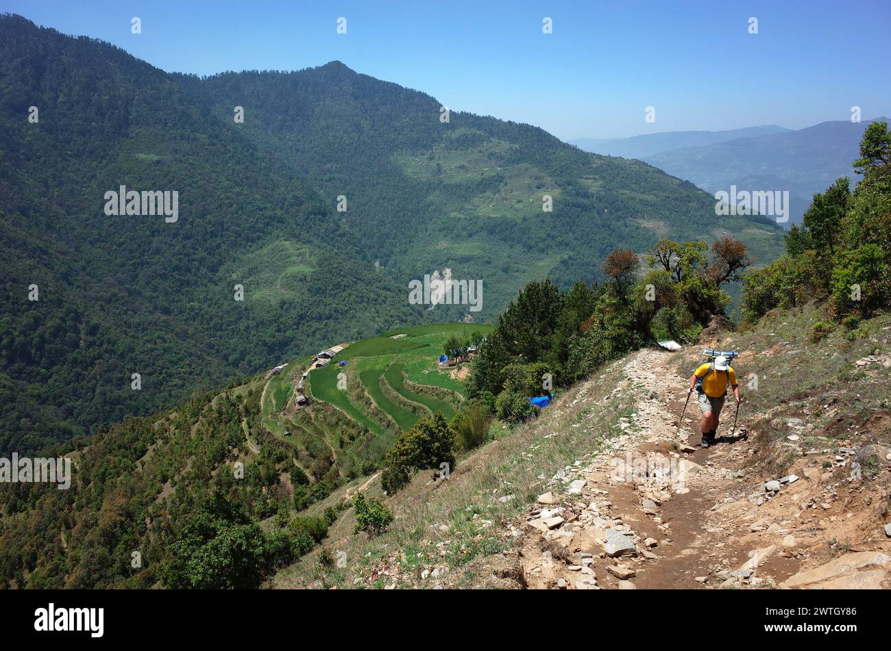 Trekking in Nepal Himalayas. Male tourist hiking on mountain path ...