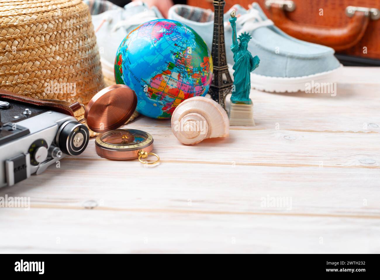 Travel planning simple background of compass, film camera, straw hat ...