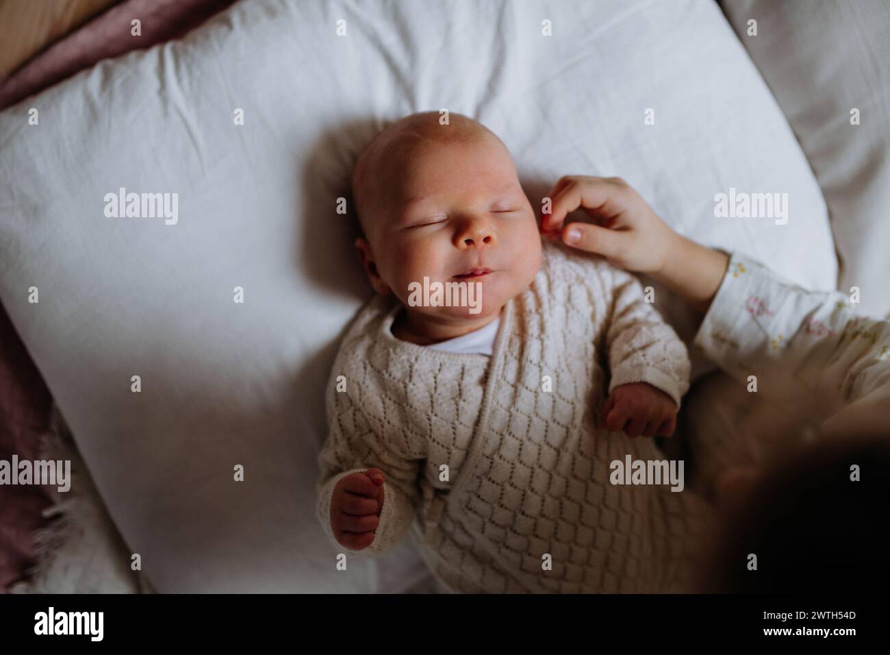 Stroking baby cheek hi-res stock photography and images - Alamy
