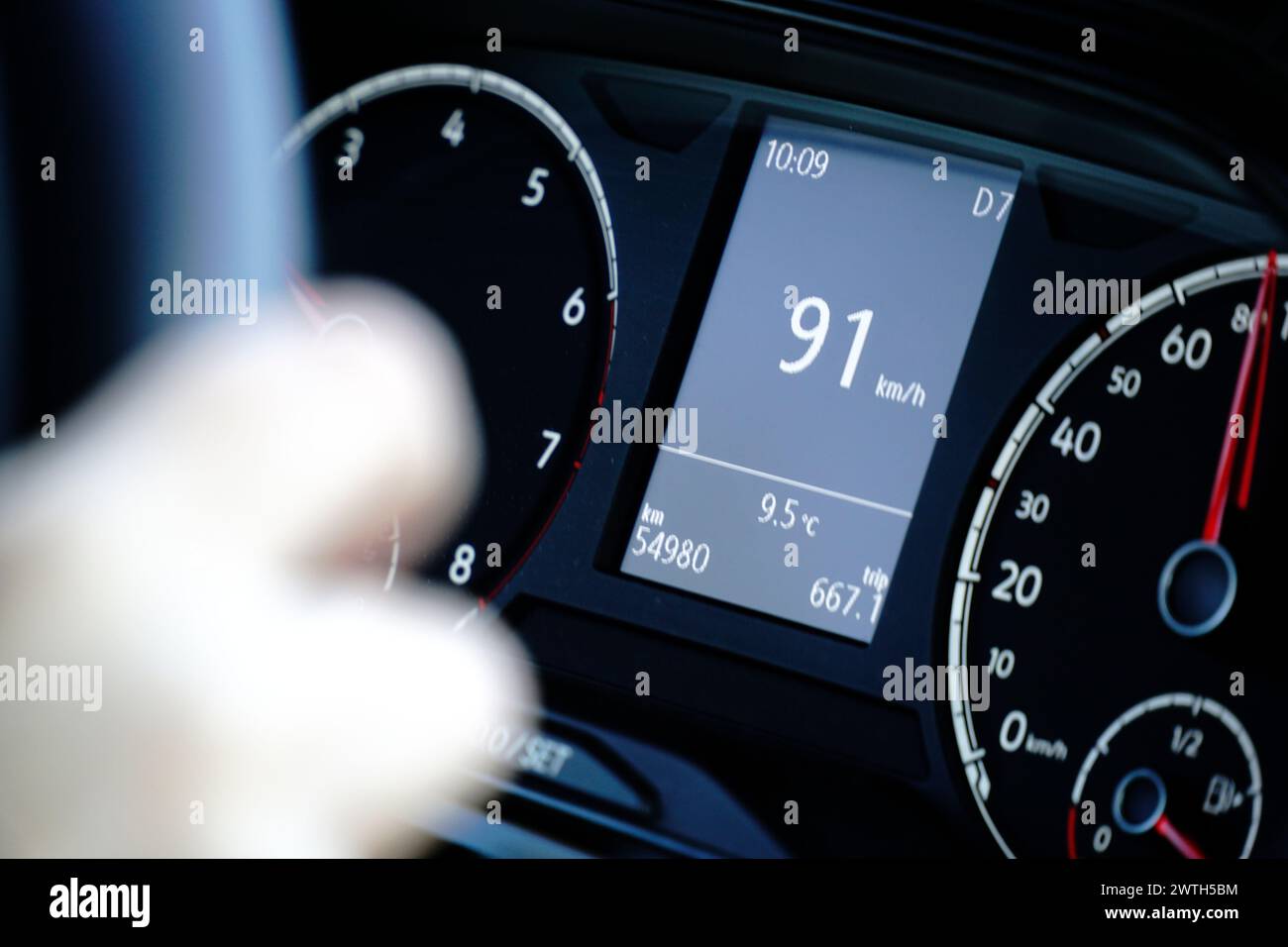 Speedometer and hands on a steering wheel - driving at 91 kmh Stock ...