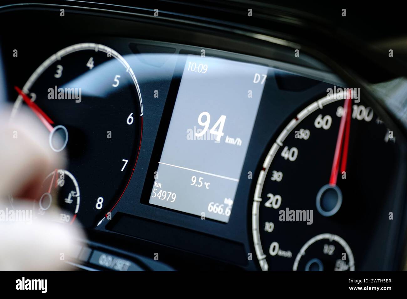 Speedometer and hands on a steering wheel - driving at 94 kmh Stock ...