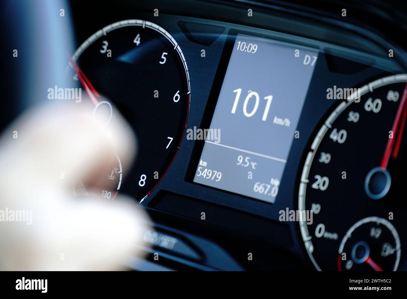 Speedometer and hands on a steering wheel - driving at 101 kmh Stock ...
