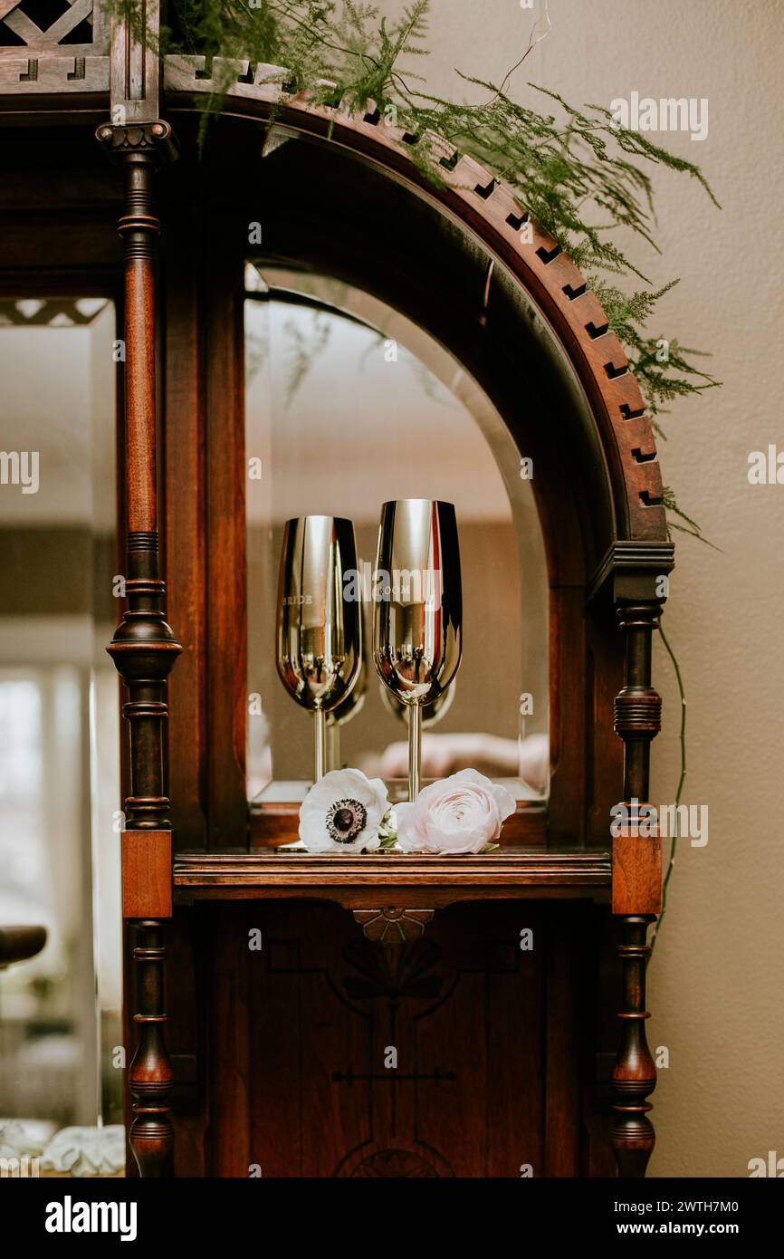 gold champagne wedding flutes in wooden display stand Stock Photo - Alamy