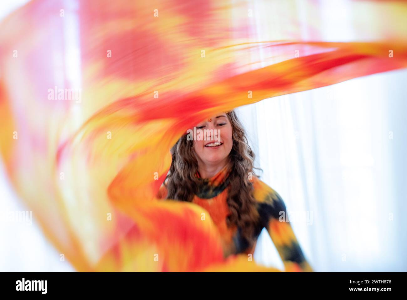 A pretty 32 year old woman dancing with fabric Stock Photo - Alamy