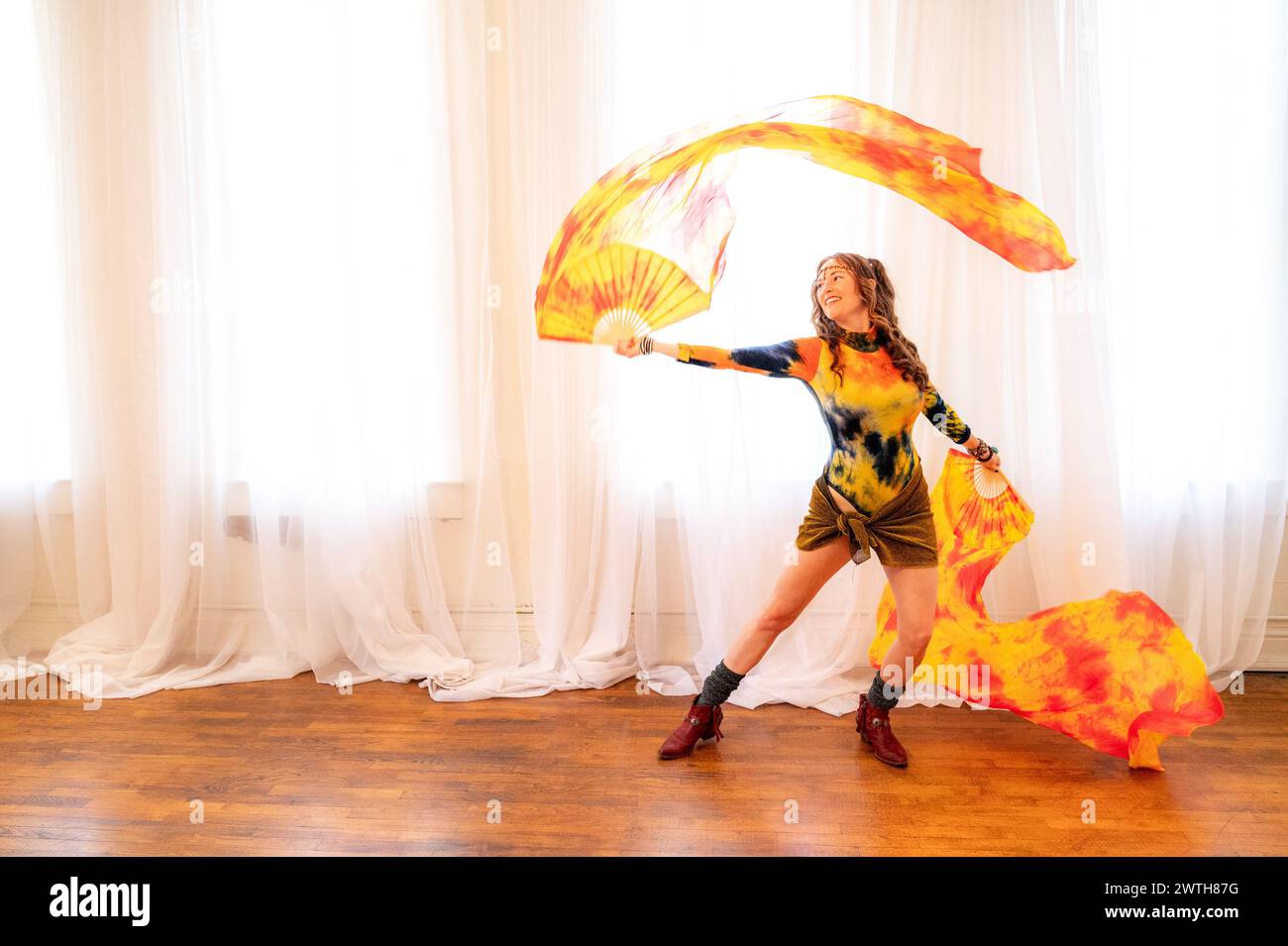 A pretty 32 year old woman dancing with fabric Stock Photo - Alamy