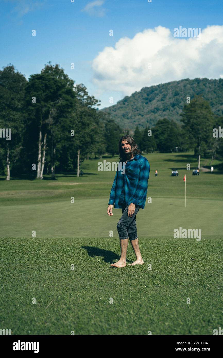 Golf course. Barefoot man on the golf course Stock Photo - Alamy