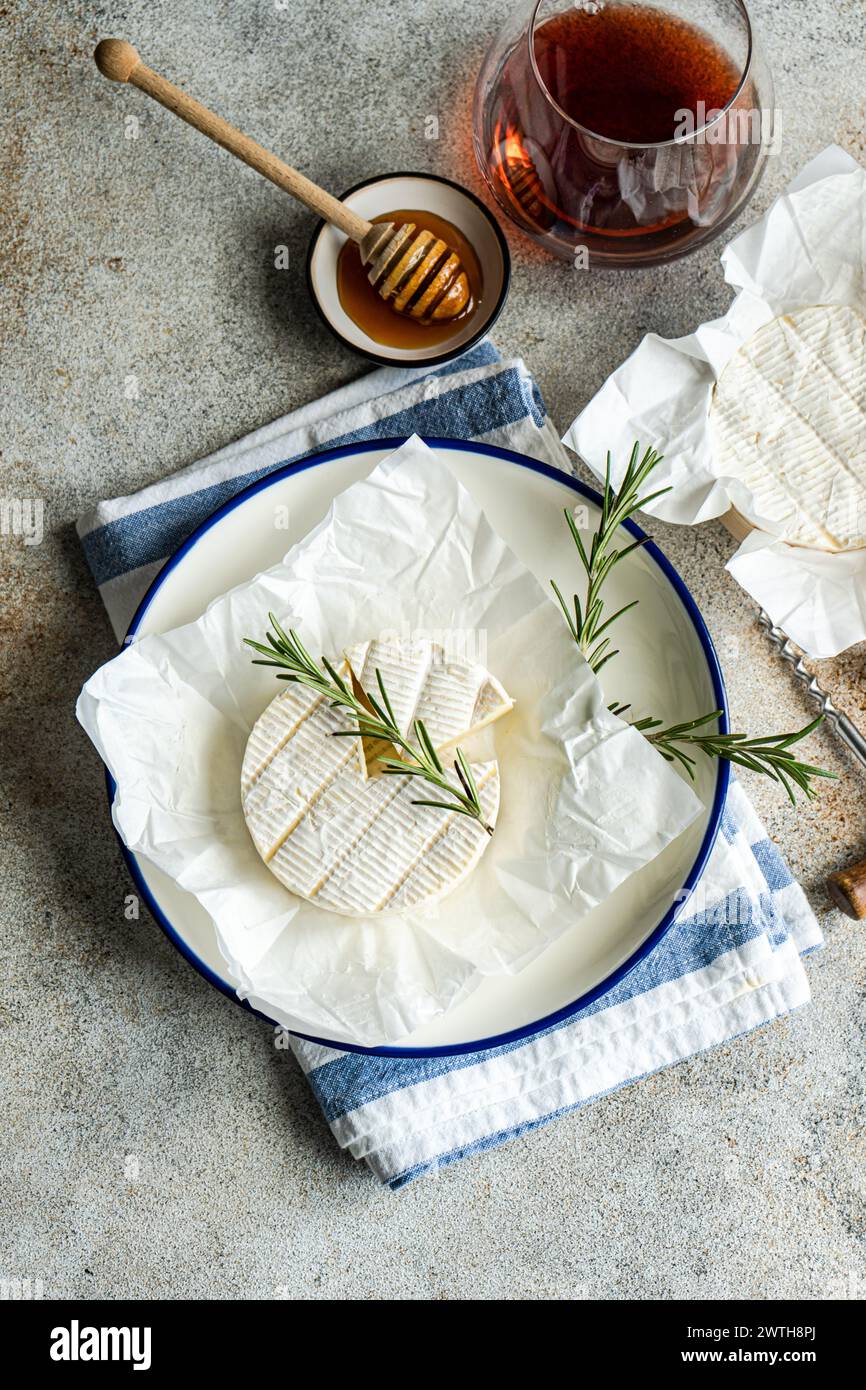 Ceramic plate with head of Brie cheese Stock Photo - Alamy