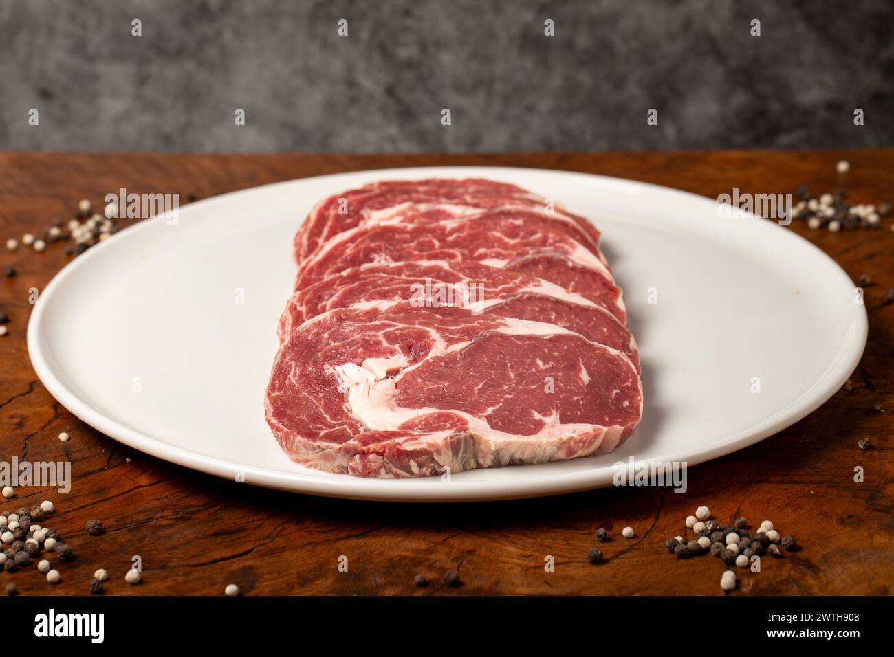 Raw beef ribeye meat. Butcher products. Fresh beef ribeye meat on dark ...