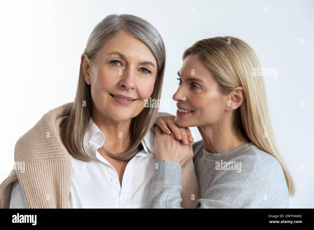 Mother and daughter feeling good with each other and looking contented ...