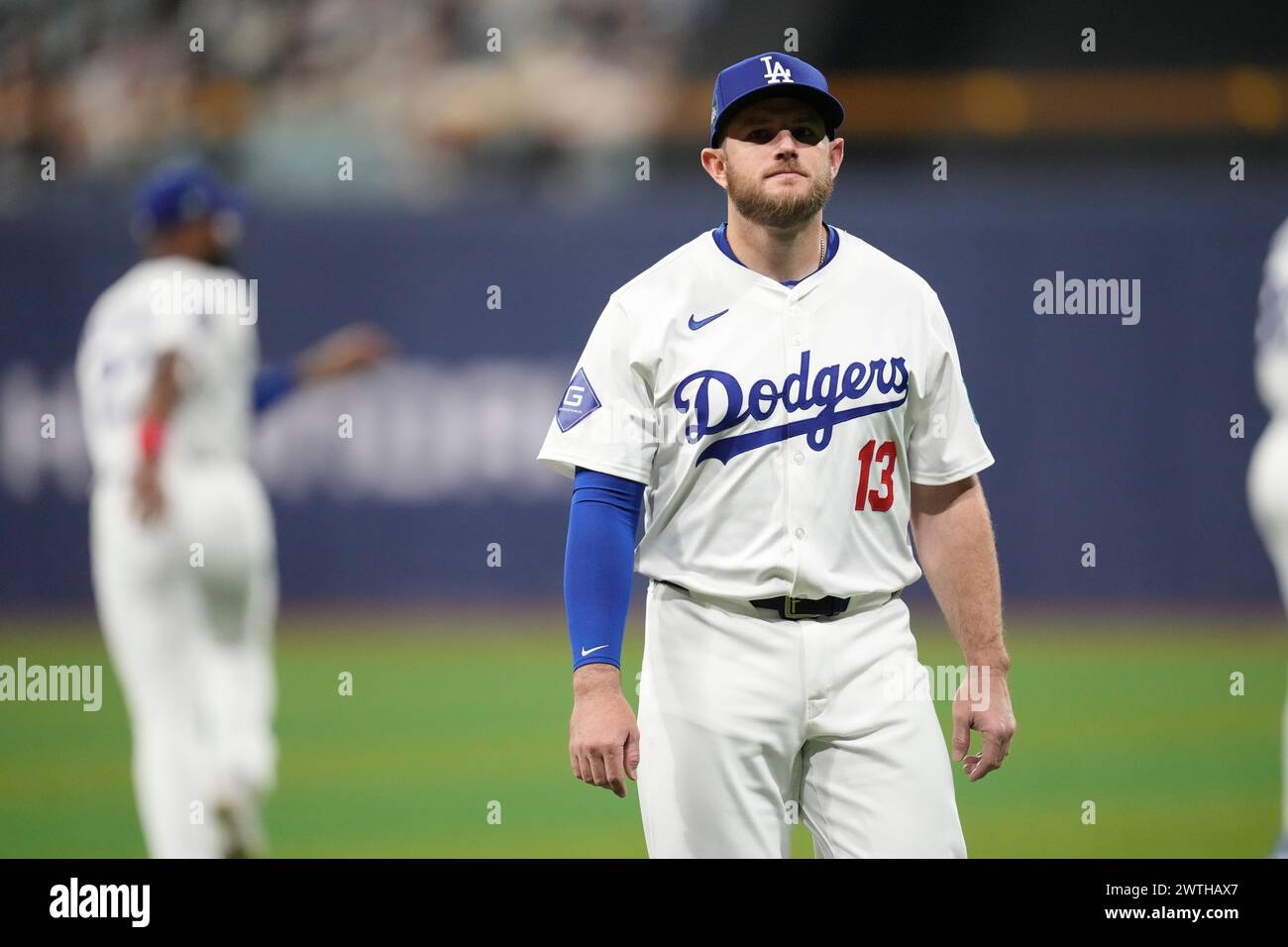 Los Angeles Dodgers' Max Muncy warms up before an exhibition game ...