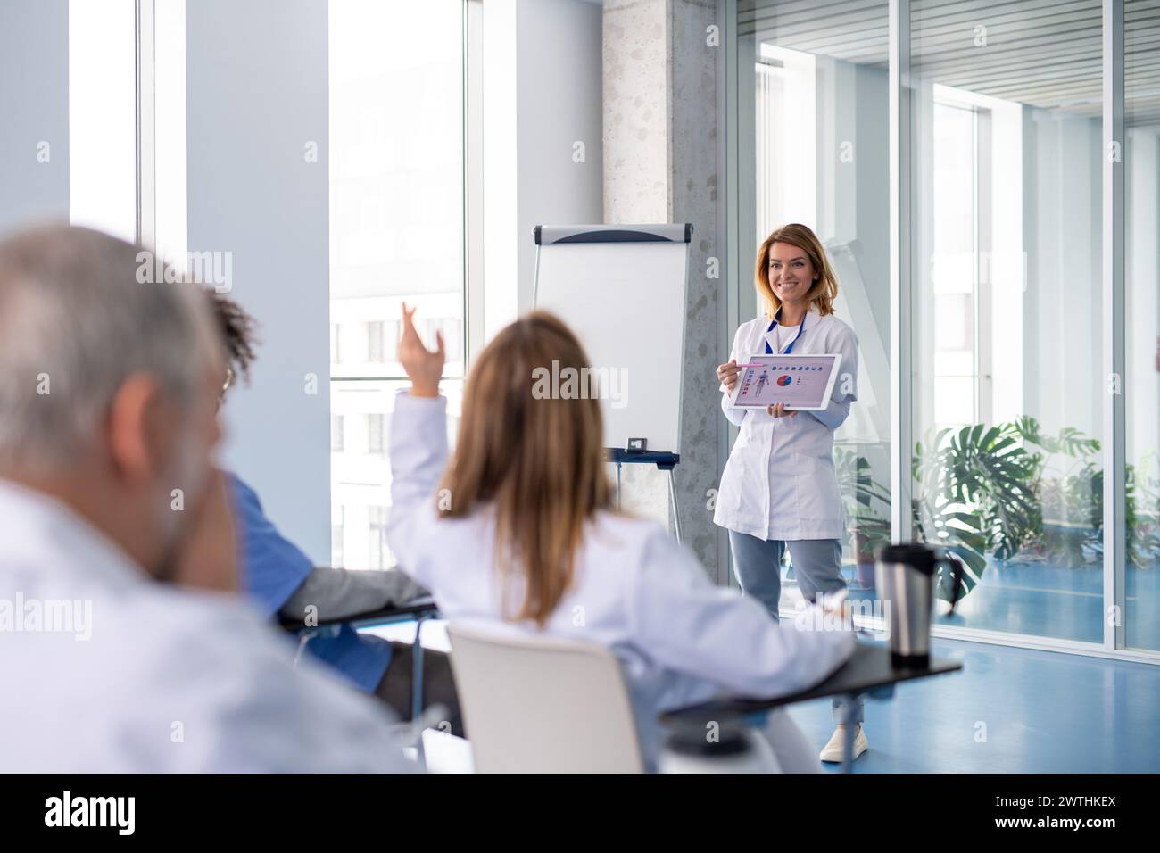 Female doctor as speaker at conference for healtcare workers, medical ...